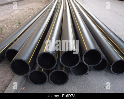 Sanitary piping. Plastic stacked PVC plastic industrial pipes on ...