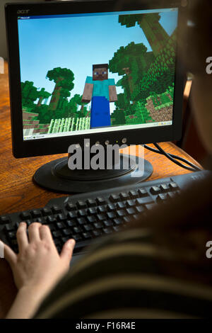 Teenage girl playing Minecraft at home Stock Photo - Alamy