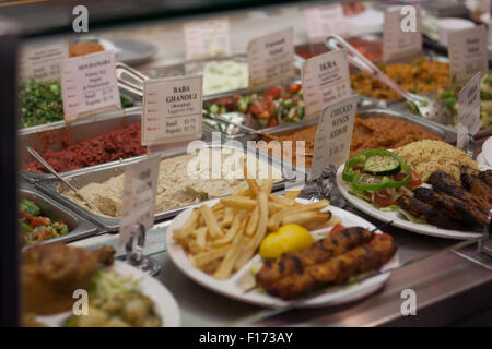 Baba ghanoush or eggplant hummus in dark bowl on brown background ...