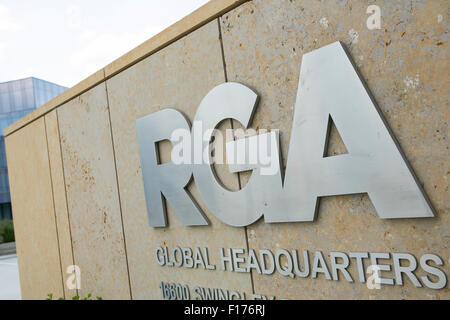 A logo sign outside of the headquarters of Reinsurance Group of America ...