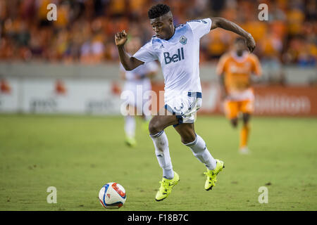 Vancouver Whitecaps defender Sam Adekugbe (3) dribbles past the defense ...