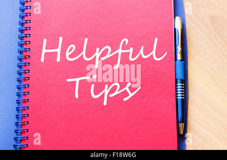 Red notepad and Helpful tips text concept Stock Photo - Alamy