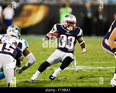 New England Patriots defensive line coach DeMarcus Covington wears a ...