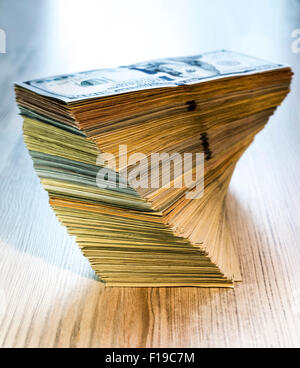 thick stack of hundred-dollar bills isolated on a white background ...
