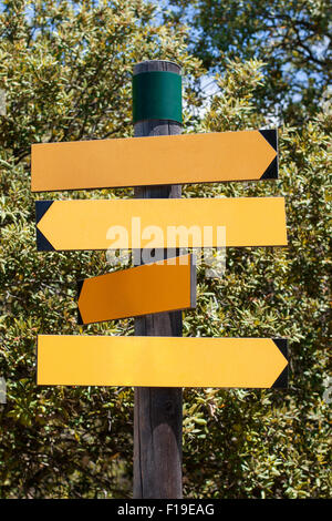 Wooden Road Sign with Three Arrow Boards Isolated on White Background ...