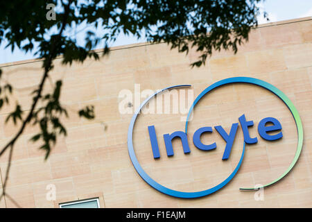 A logo sign outside of the headquarters of the Incyte Corporation in ...
