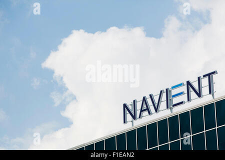A logo sign outside of the headquarters of the Navient Corporation in ...
