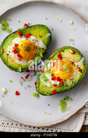 egg baked in avocado with spring onion and alfalfa sprouts Stock Photo ...