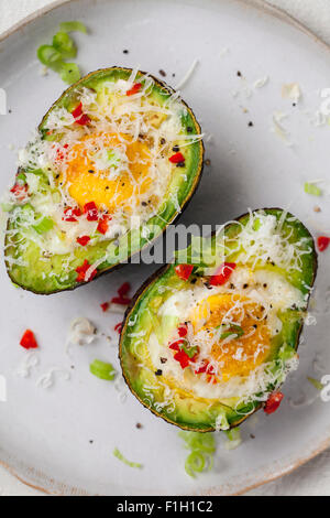 egg baked in avocado with spring onion and alfalfa sprouts Stock Photo ...