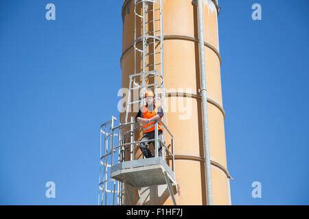 Man Climbing Smoke Stack Stock Photo - Alamy