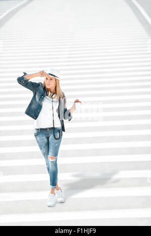 Walking on zebra cross Stock Photo - Alamy