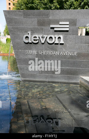 A logo sign outside of the Devon Energy Center, headquarters of the ...