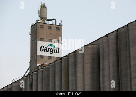 A logo sign outside of a grain elevator facility operated by Cargill ...