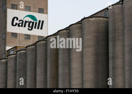 A logo sign outside of a grain elevator facility operated by Cargill ...