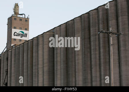 A logo sign outside of a grain elevator facility operated by Cargill ...