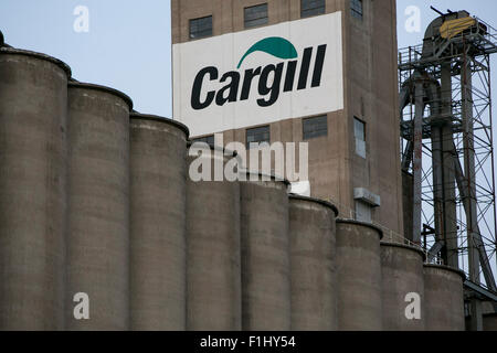 A logo sign outside of a grain elevator facility operated by Cargill ...