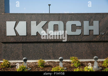 A logo sign outside of the headquarters of Koch Industries, Inc., in ...