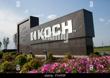 A logo sign outside of the headquarters of Koch Industries, Inc., in ...