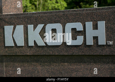 A logo sign outside of the headquarters of Koch Industries, Inc., in ...