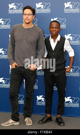 Director Cary Fukunaga and actor Abraham Attah (r) attend the premiere ...