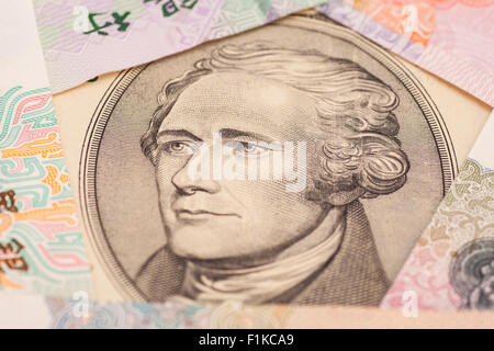 Ten dollar bill surrounded by Chinese Yuan Stock Photo - Alamy