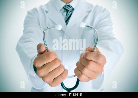 Young doctor man wearing stethoscope over isolated background In shock ...