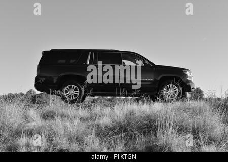 Chevrolet Suburban parked by the side of the road Stock Photo - Alamy