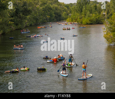 People floating the Boise River on a summer day. Boise Rver Greenbelt ...