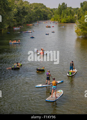 People floating the Boise River on a summer day. Boise Rver Greenbelt ...