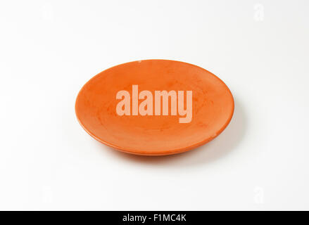 empty orange plate on white background Stock Photo - Alamy
