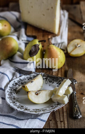 Coscia pears with slices of italian asiago cheese Stock Photo - Alamy