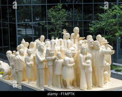 Illuminated Crowd Sculpture by Raymond Masson in front of a Stock Photo ...