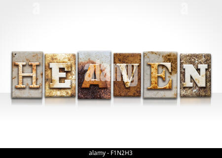The word "HEAVEN" written in rusty metal letterpress type on a crumbled ...