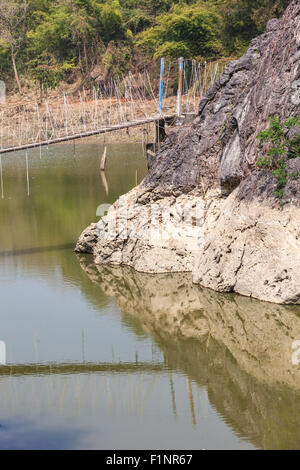 Swing Bridge Between Rocks Stock Photo - Alamy