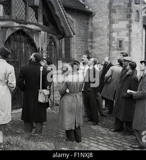 Historical, 1950s, group of local councilors outside a church building ...