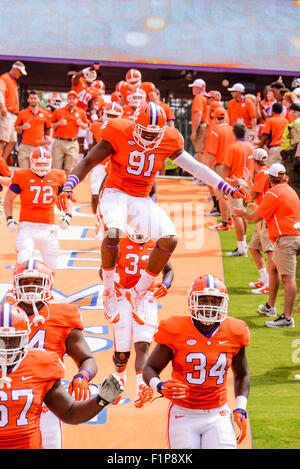 Clemson players run down the hill during the NCAA college football game ...