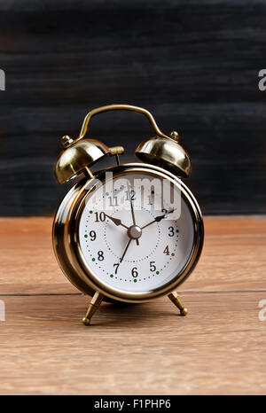 Countdown to midnight. Wood alarm clock with red baubles, Santa hats ...