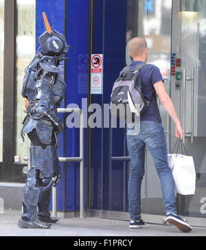 A person dressed as Chappie, the police droid from the movie of the ...