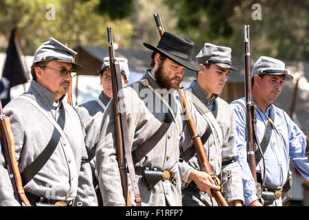 Confederate civil war soldiers standing in line drinking from canteen ...