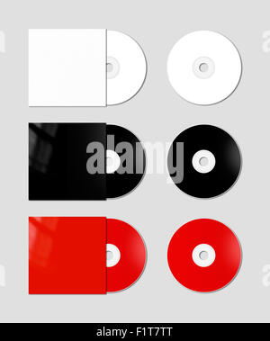 white, black and red CD - DVD and covers isolated on black wood ...