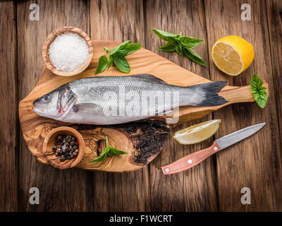 Sea bass fish on the graphite board Stock Photo - Alamy