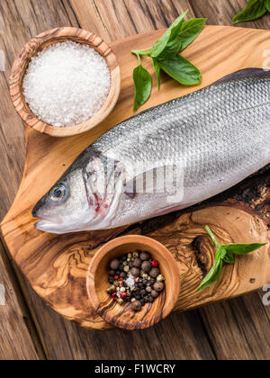 Sea bass fish on the graphite board Stock Photo - Alamy
