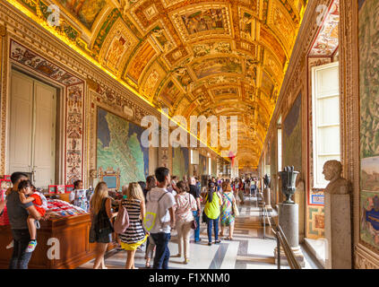 Tourists visiting The long Gallery of Maps in the Vatican Museums Vatican City Rome Italy EU ...