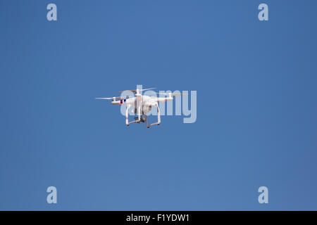 Flying Drone Against Blue Sky Stock Photo - Alamy