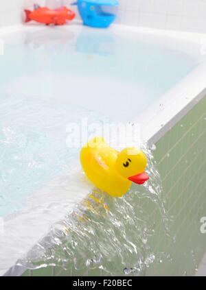 a toy rubber duck and falling water Stock Photo - Alamy