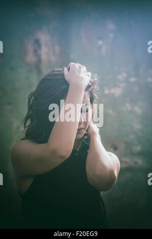 Scared woman hiding face with hands Stock Photo - Alamy