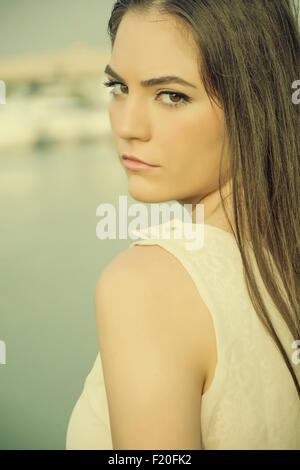 Portrait of serious young woman over white background Stock Photo - Alamy