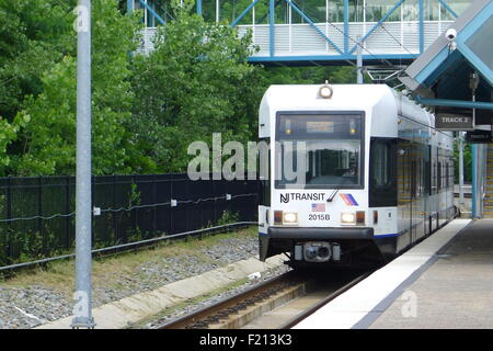 A New Jersey Transit Hudson-Bergen Light Rail (HBLR) train travels on ...
