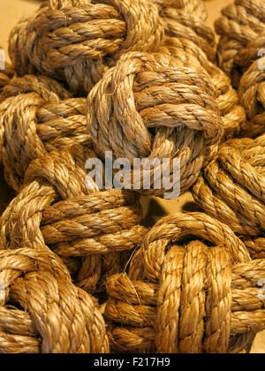 Coarse rope in stylized monkey knot configurations Stock Photo - Alamy