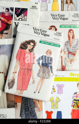 A collection of printed paper dressmaking patterns Stock Photo - Alamy